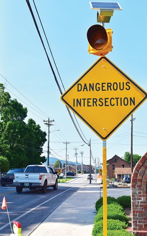 Warning sign placed at intersection - Southern Standard